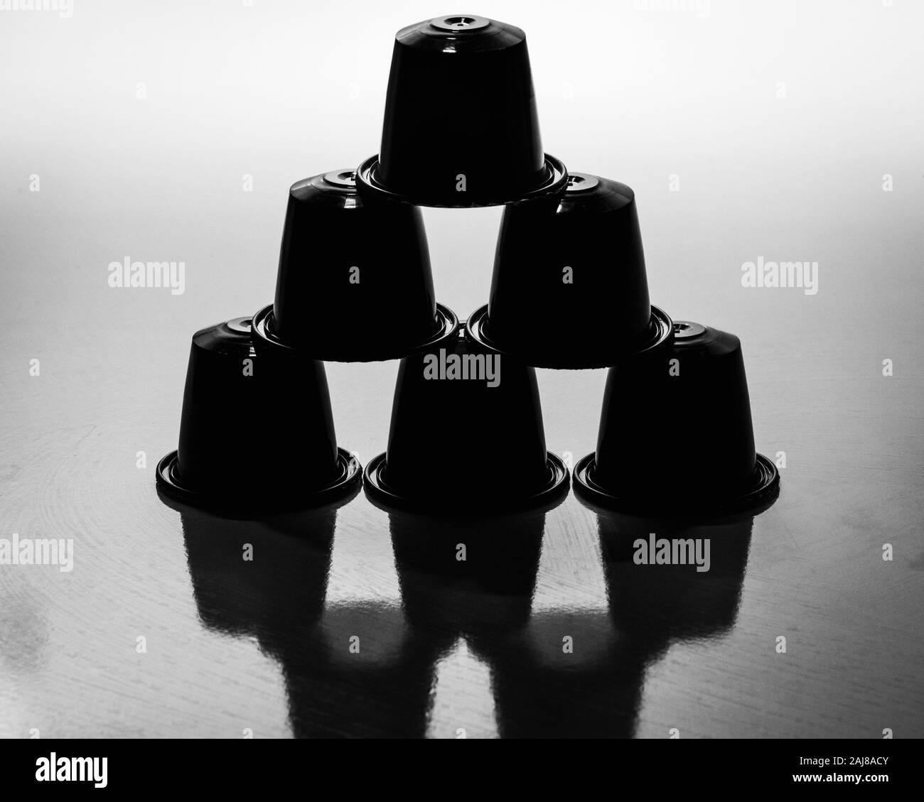 Dark coffee capsules Black and White Stock Photos & Images - Alamy
