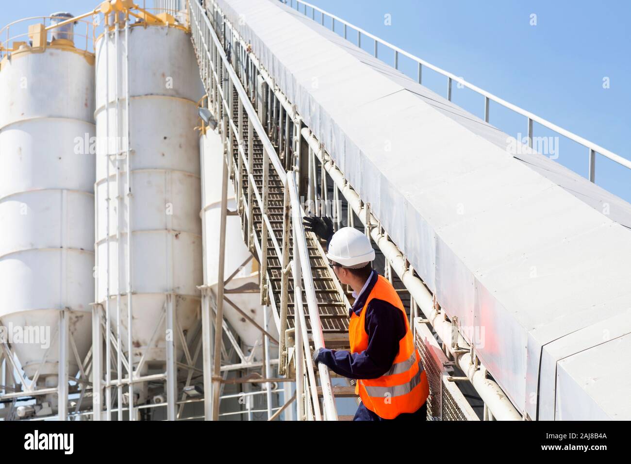concrete worker with helmet in concrete plant Stock Photo - Alamy