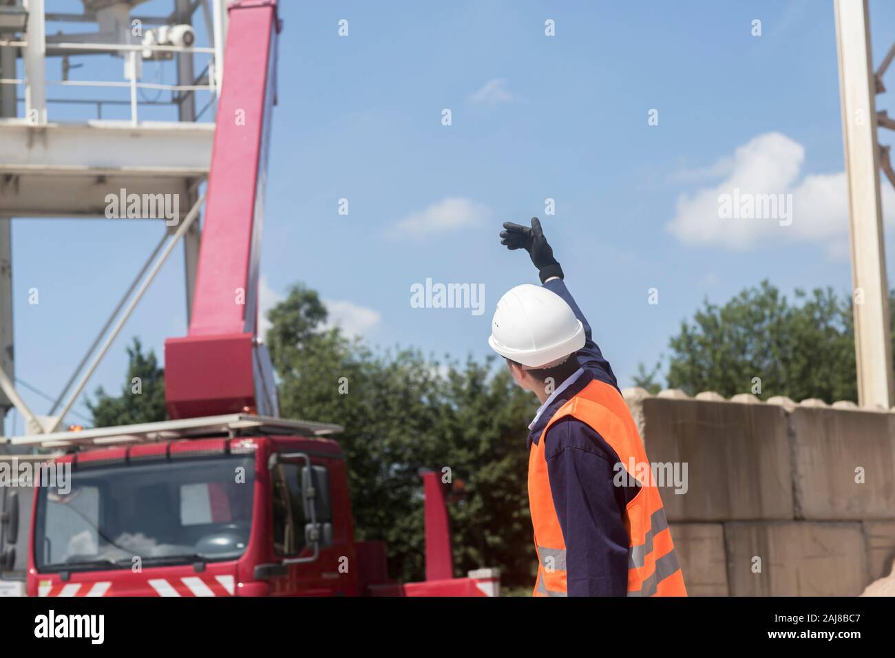 Worker waving hi-res stock photography and images - Alamy