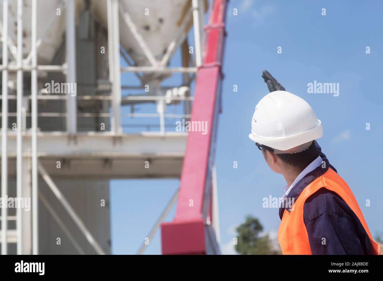 concrete worker waving in a concrete factory Stock Photo - Alamy