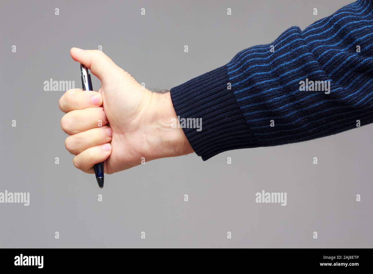 Adult hand with a pen to write ideas, sign contracts or take student ...