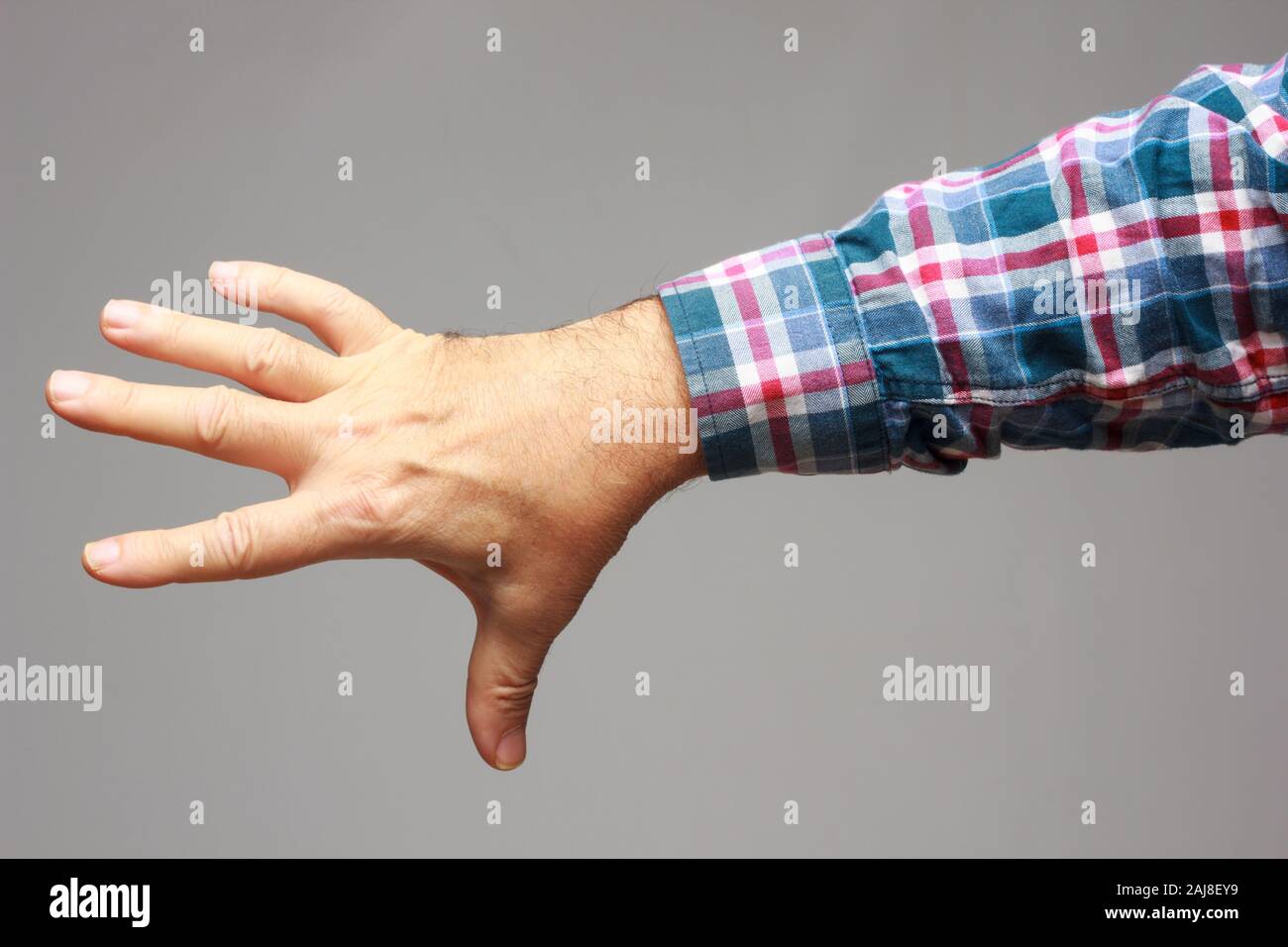 Hand of an adult person making signs and signals, showing numbers ...