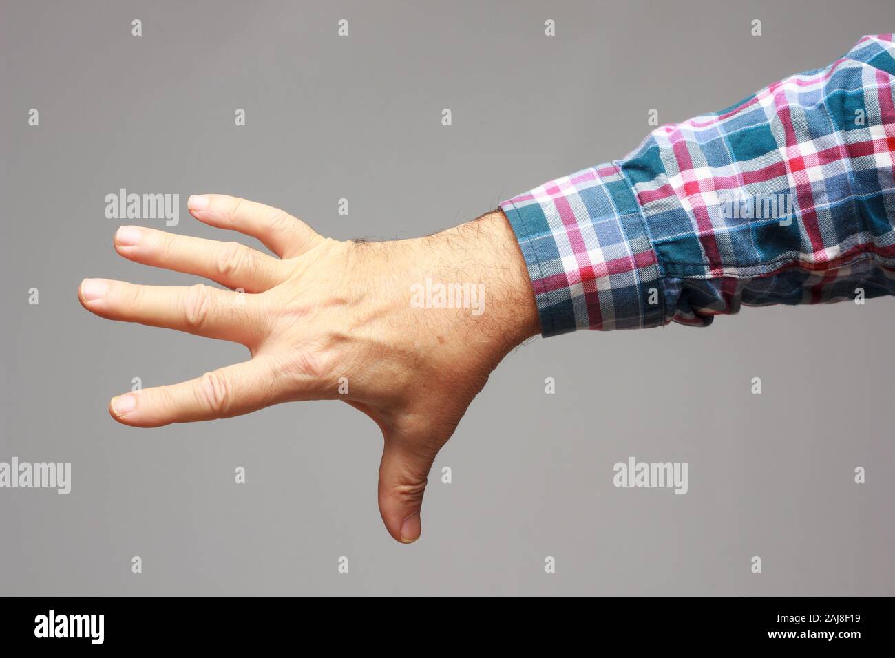 Hand of an adult person making signs and signals, showing numbers ...