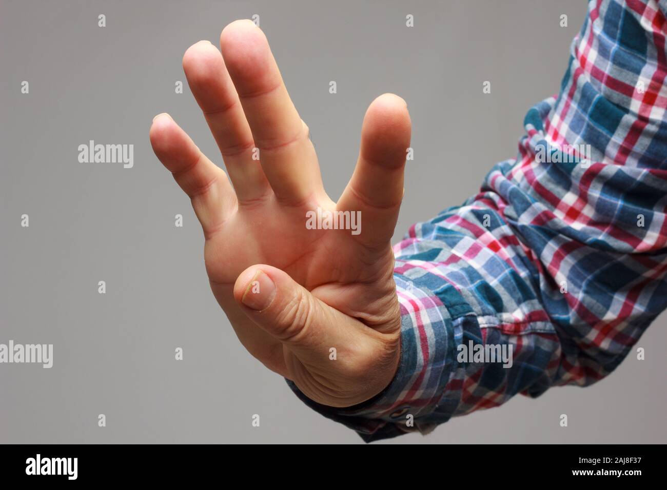 Hand of an adult person making signs and signals, showing numbers ...
