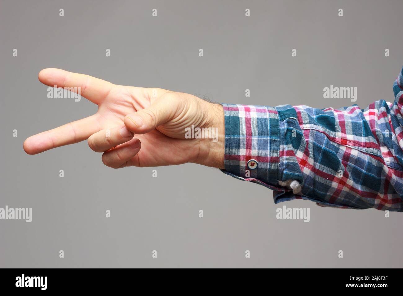 Hand of an adult person making signs and signals, showing numbers ...
