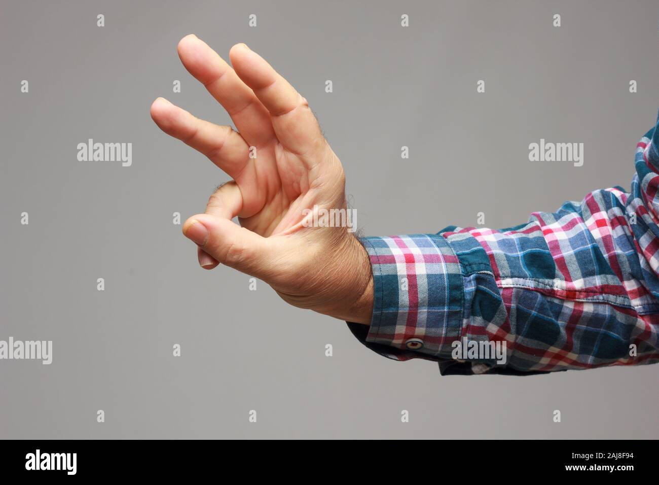 Hand of an adult person making signs and signals, showing numbers ...