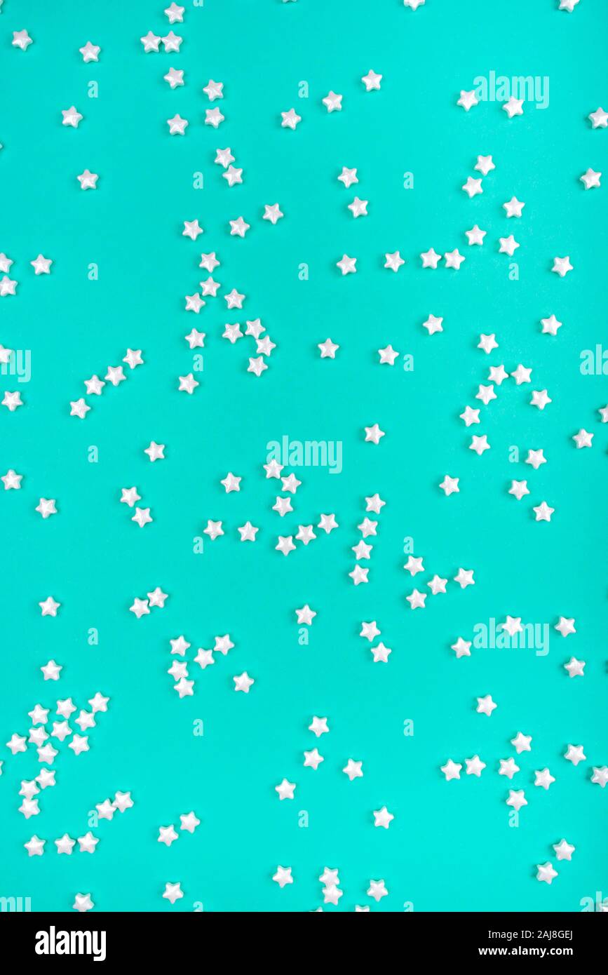 Little white stars on mint background Stock Photo - Alamy