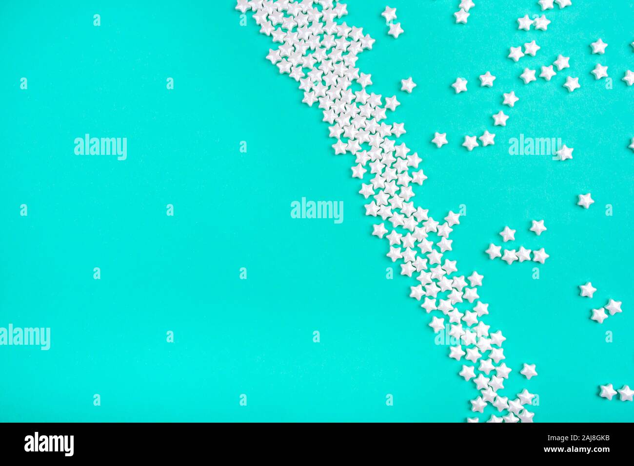 Little white stars on mint background Stock Photo - Alamy