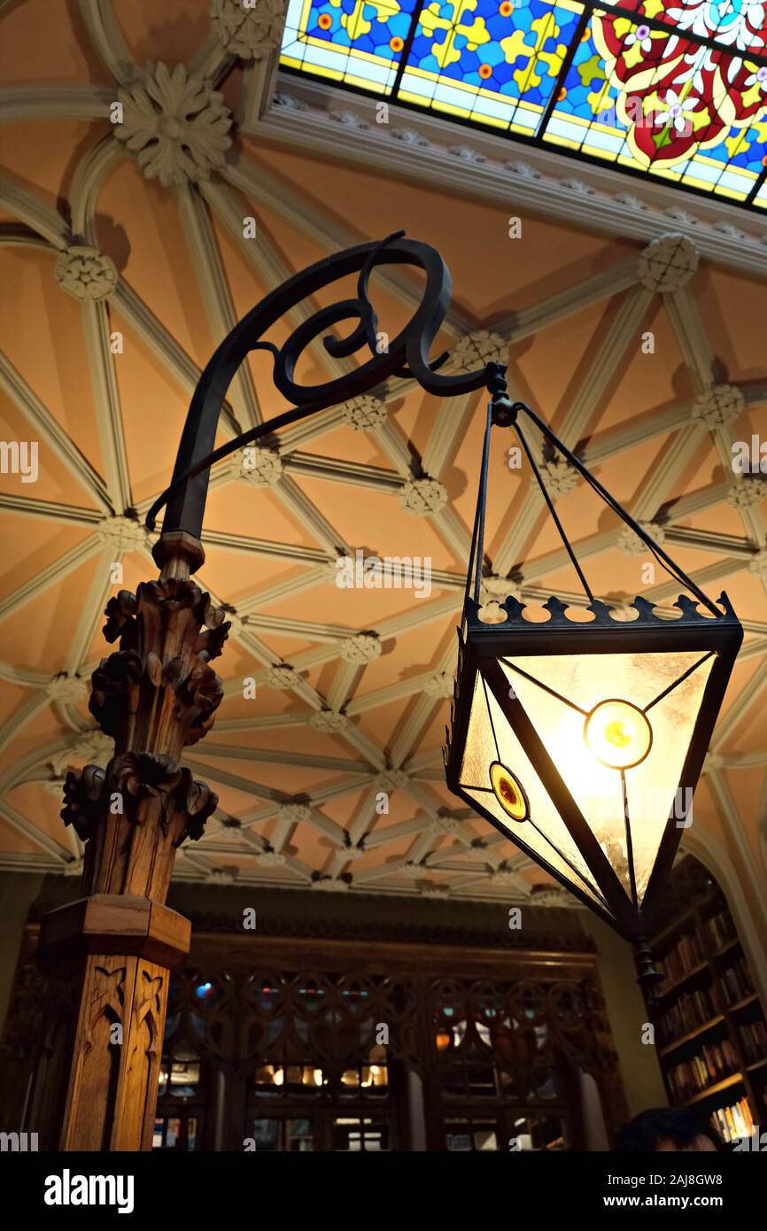 View of the decorated lamp inside the Lello & Irmao library in Porto ...