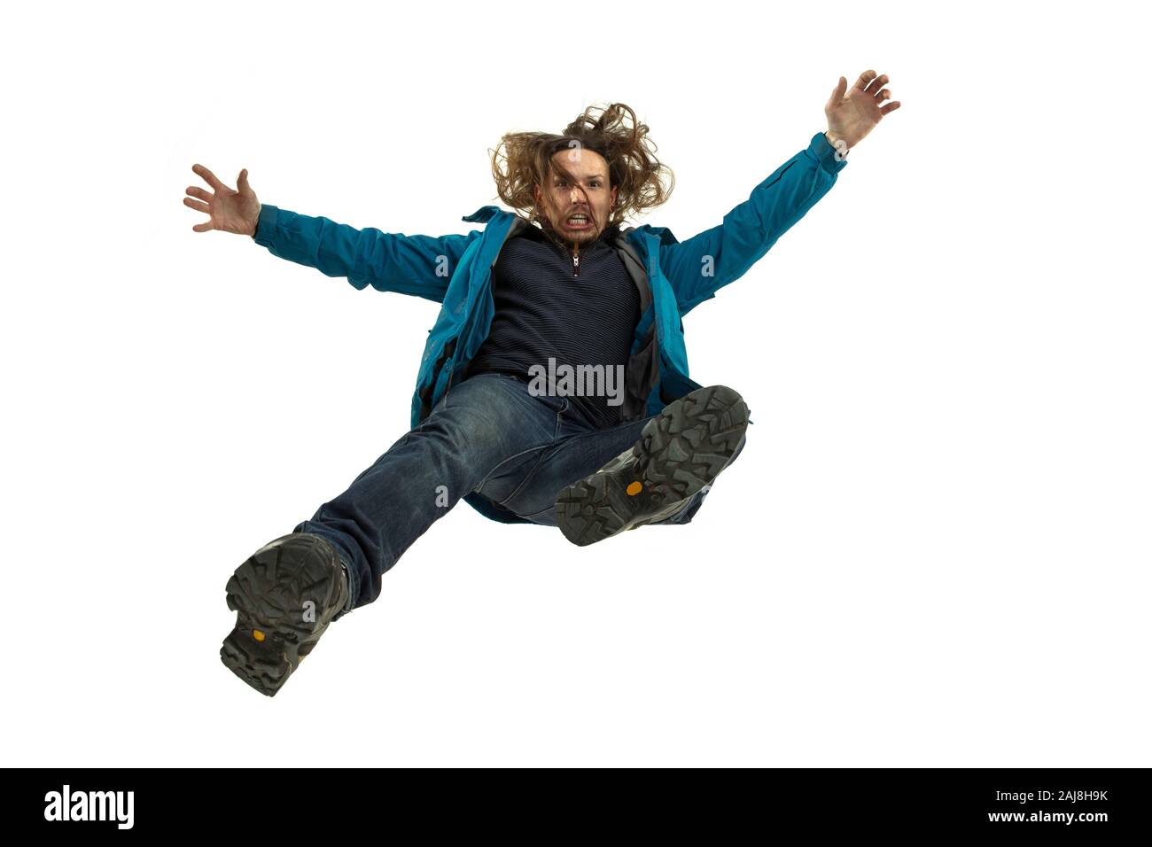 A second before falling. Caucasian young man falling down in moment ...