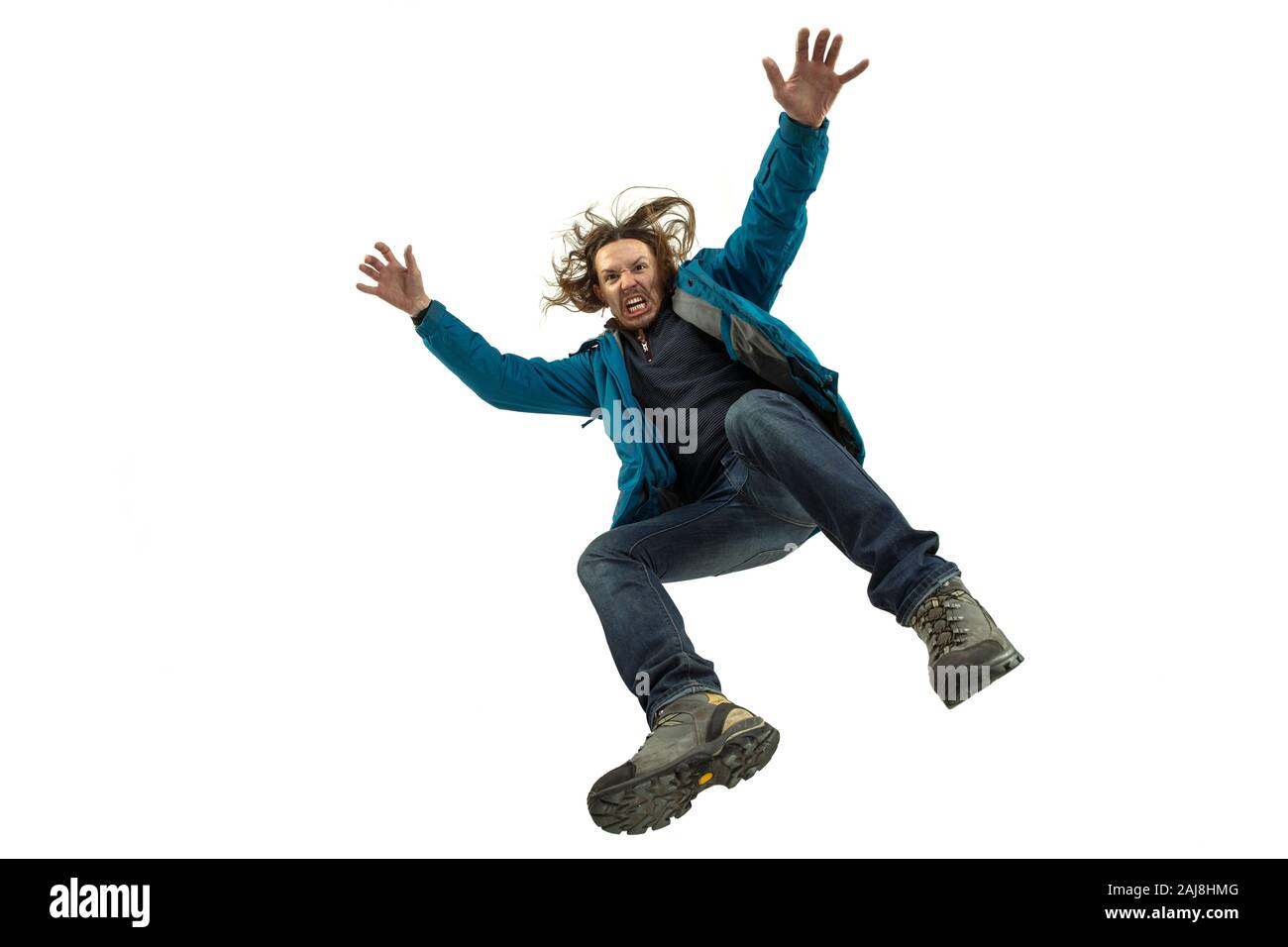 A second before falling. Caucasian young man falling down in moment ...