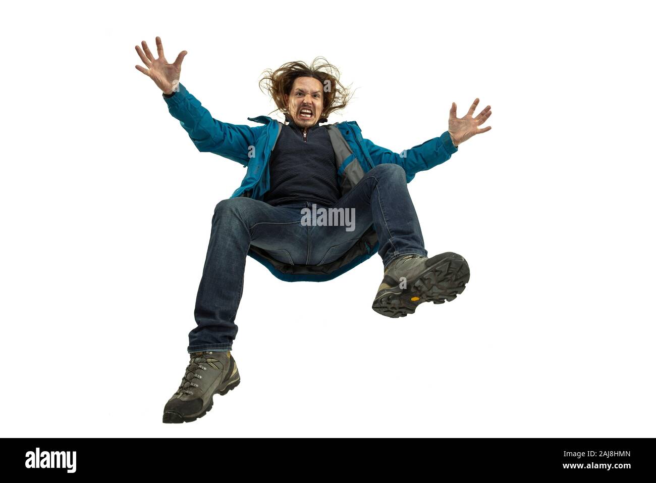 A second before falling. Caucasian young man falling down in moment ...