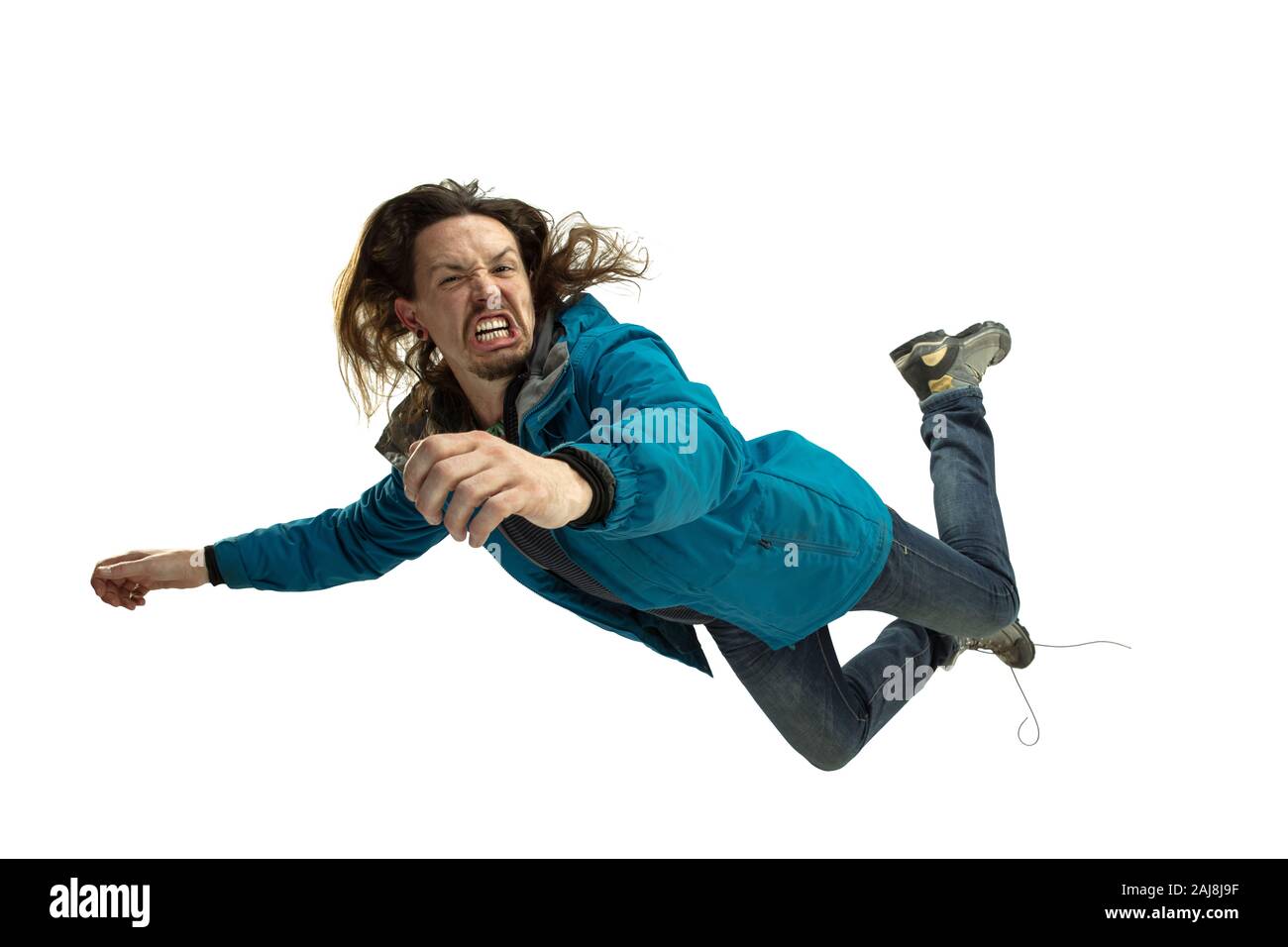 A second before falling. Caucasian young man falling down in moment ...