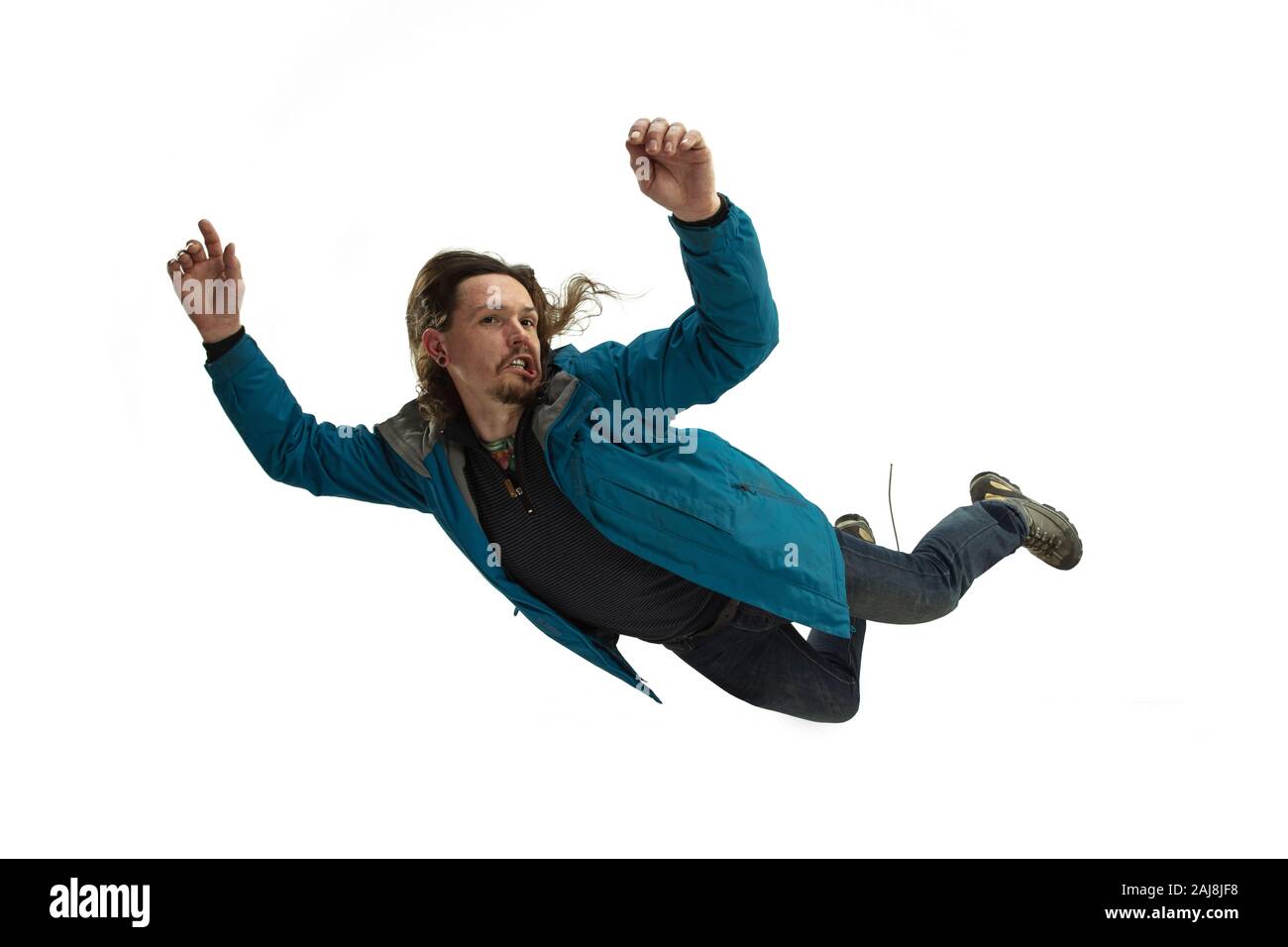 A second before falling. Caucasian young man falling down in moment ...