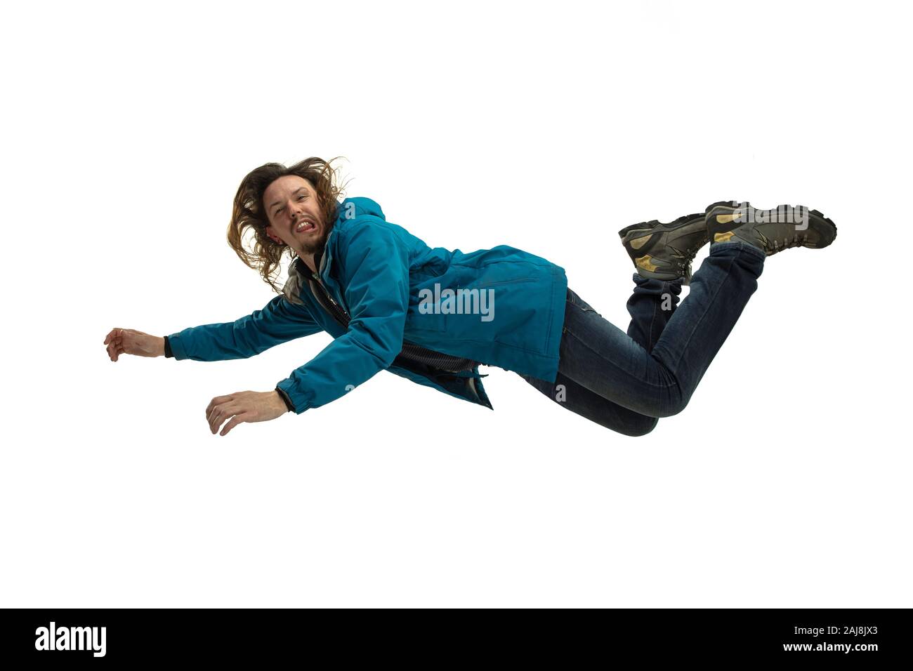 A second before falling. Caucasian young man falling down in moment ...