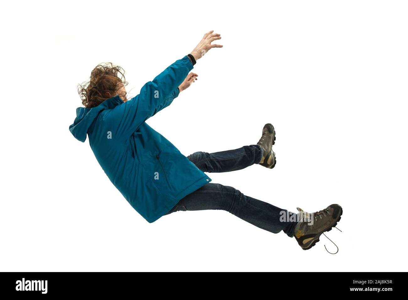 A second before falling. Caucasian young man falling down in moment ...