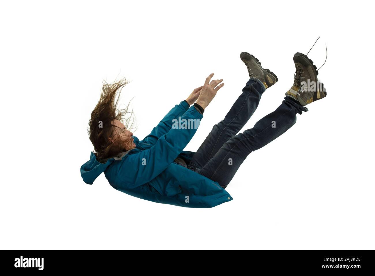 A second before falling. Caucasian young man falling down in moment ...