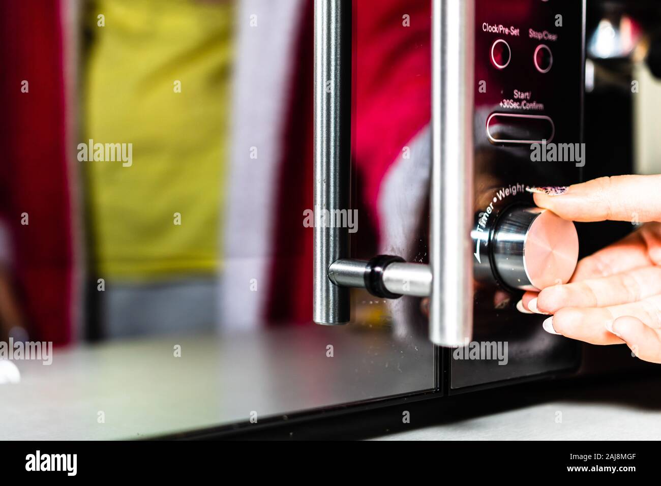 Using microwave oven hi-res stock photography and images - Alamy