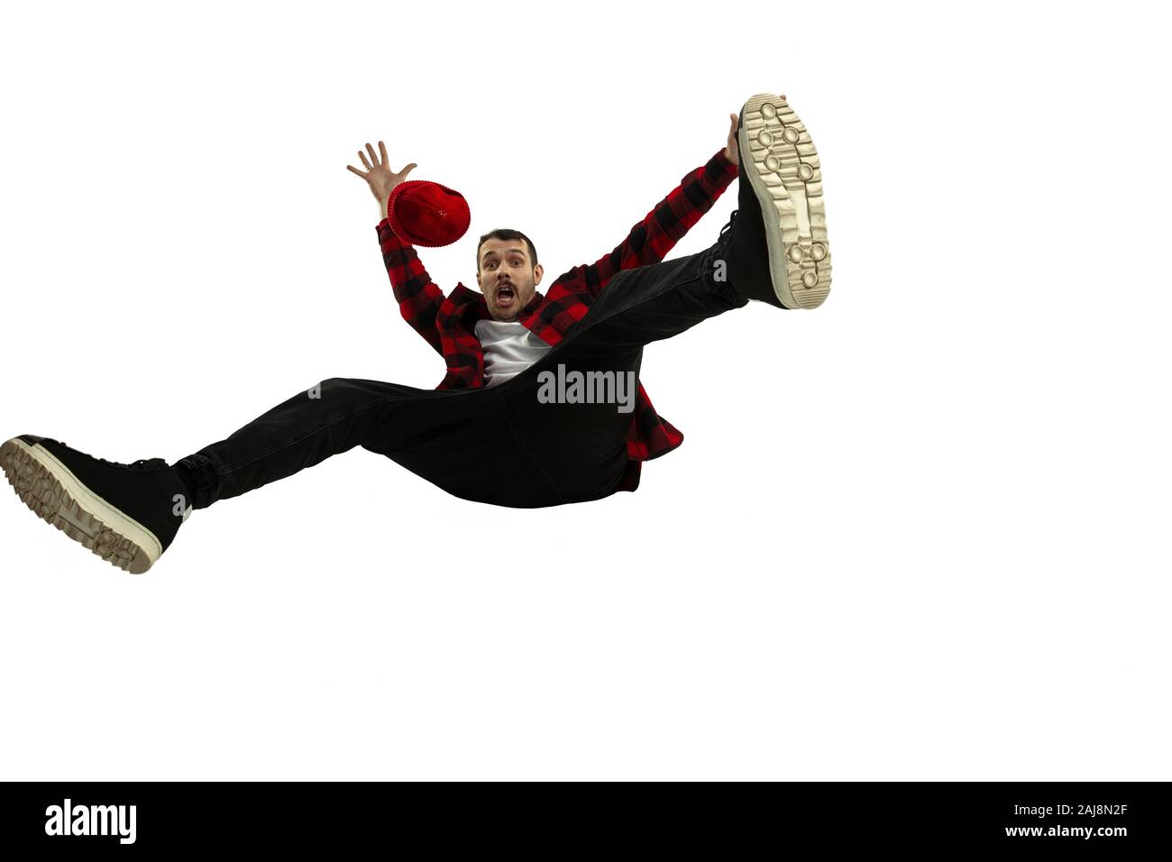 A second before falling. Caucasian young man falling down in moment ...