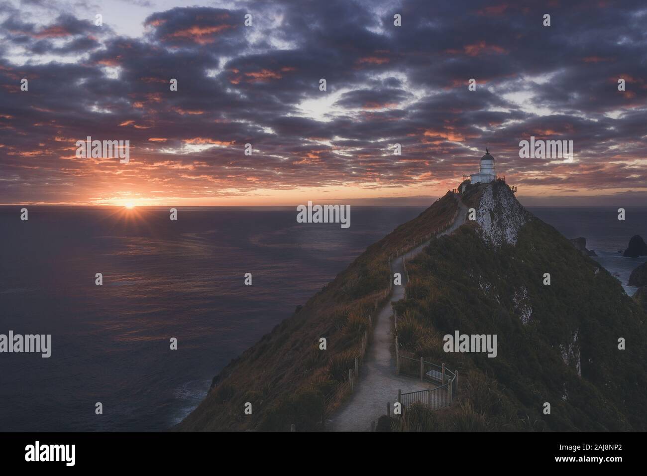 Sunset over Nugget point lighthouse, New Zealand Stock Photo - Alamy