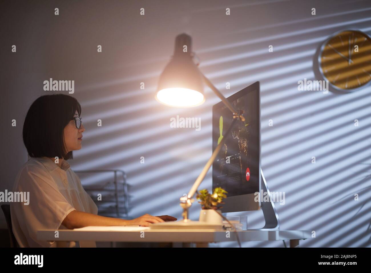 Electric lamp office sitting working concentration occupation ...