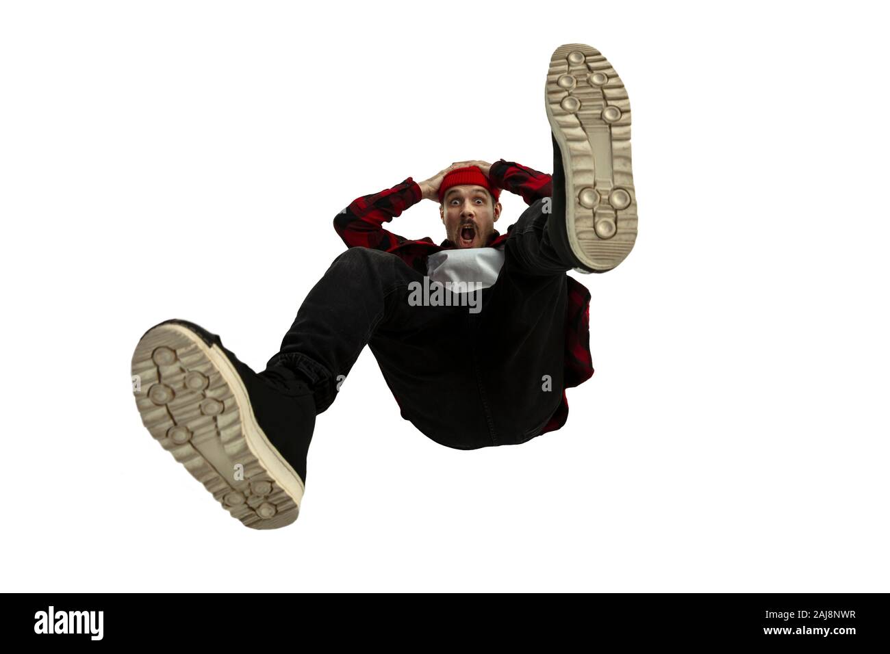 A second before falling. Caucasian young man falling down in moment ...