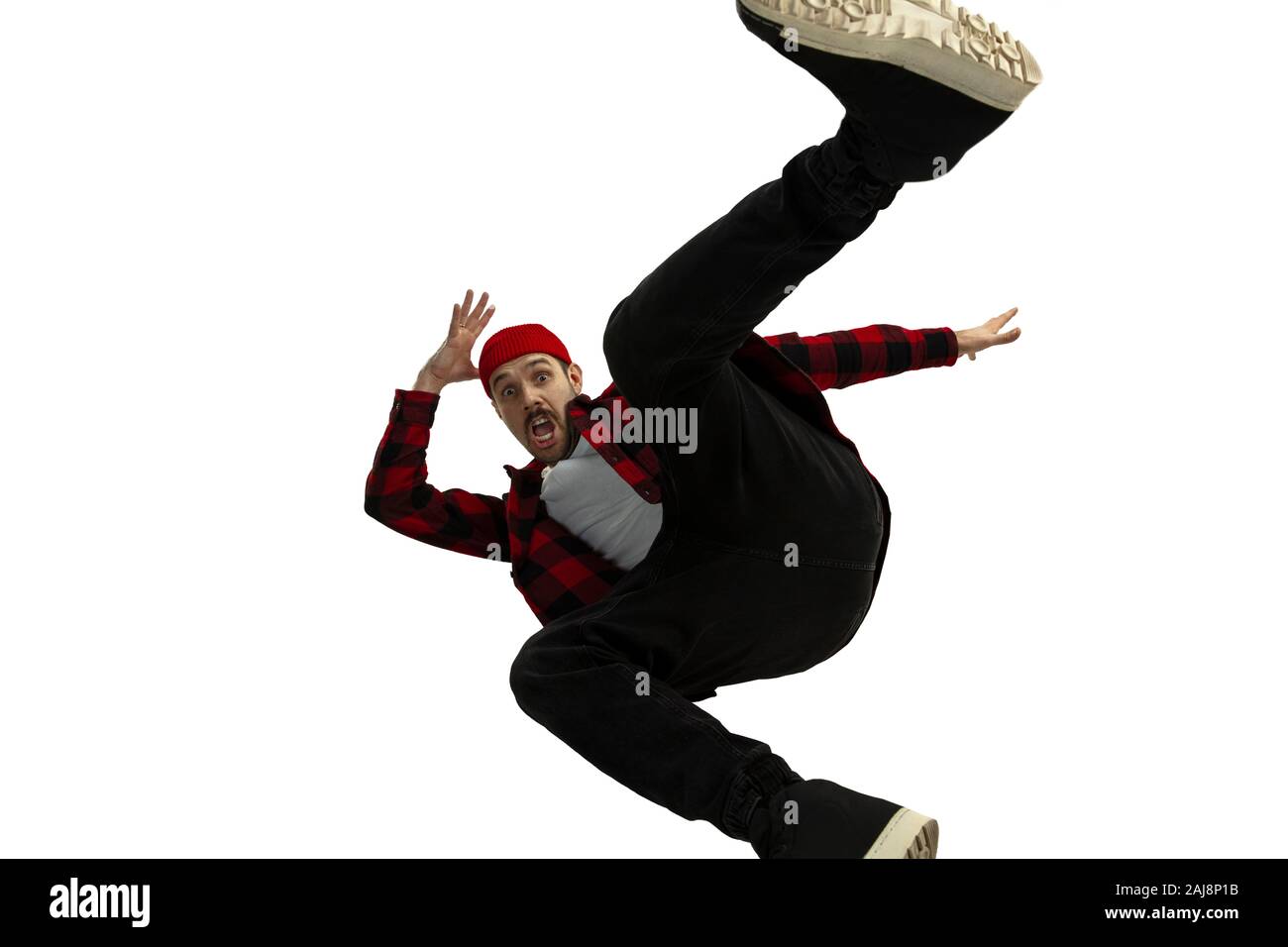 A second before falling. Caucasian young man falling down in moment ...