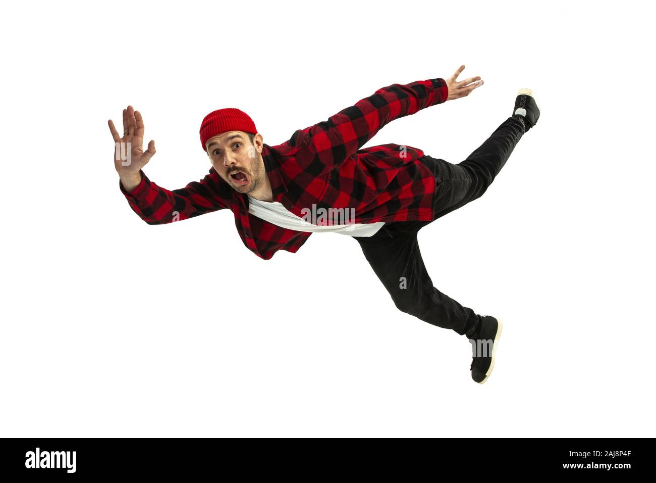 A second before falling. Caucasian young man falling down in moment ...