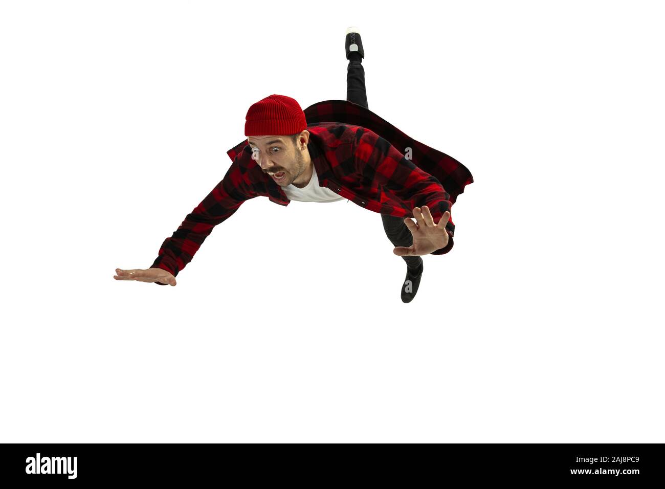 A second before falling. Caucasian young man falling down in moment ...