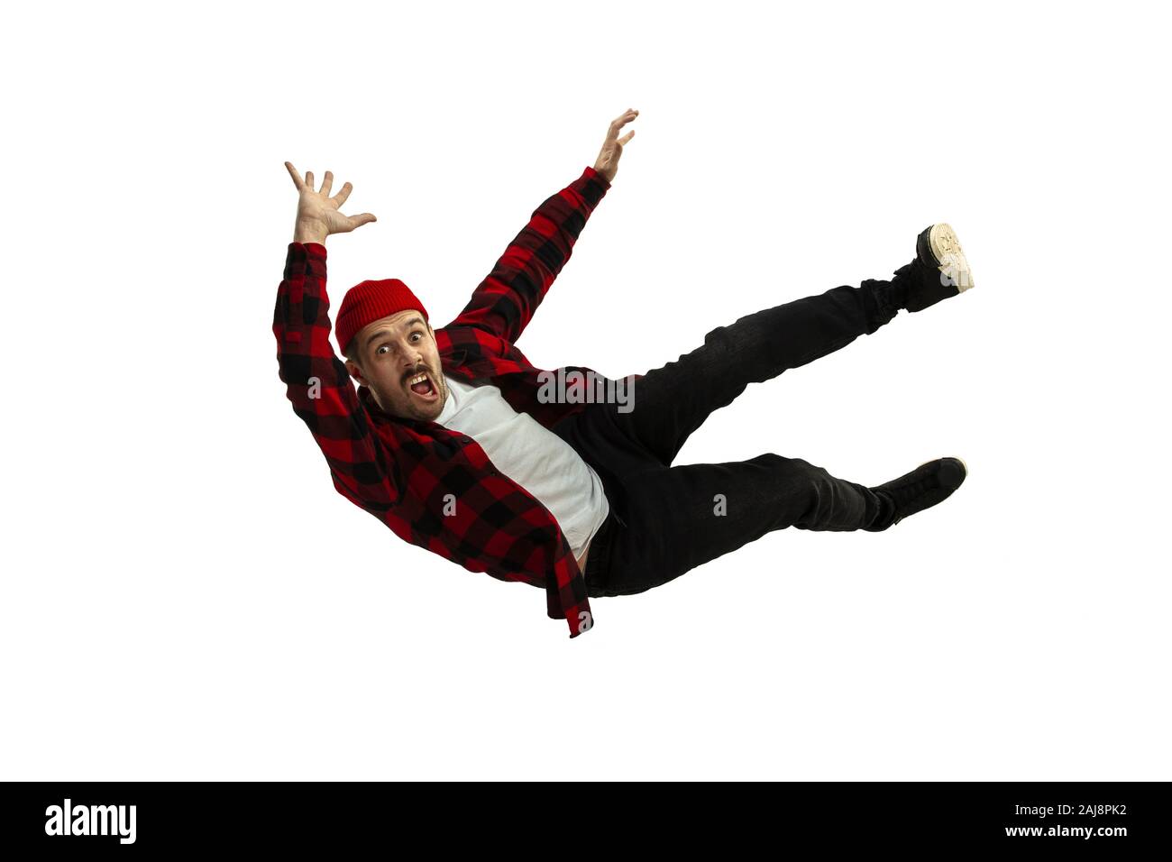 A second before falling. Caucasian young man falling down in moment ...