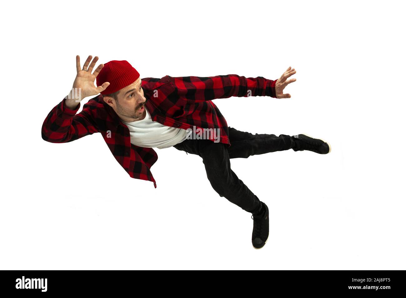 A second before falling. Caucasian young man falling down in moment ...