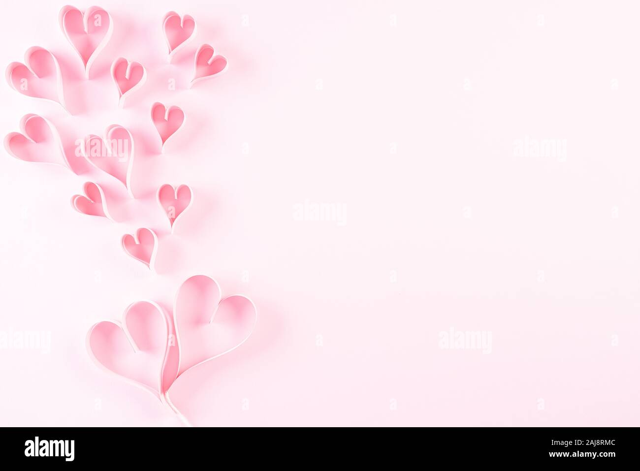 Pink paper hearts on Light pink pastel paper background. Love and ...
