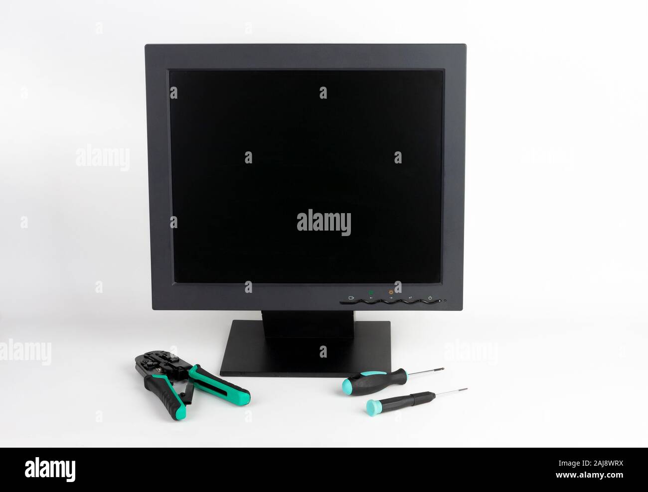 PC Lcd monitor and screwdrivers and plier on white background Stock ...