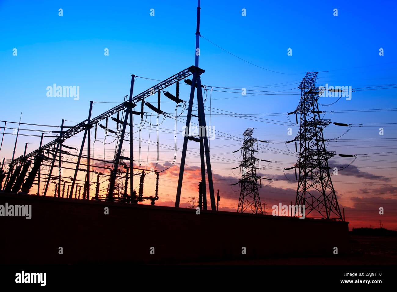 The power supply facilities of contour in the evening Stock Photo - Alamy