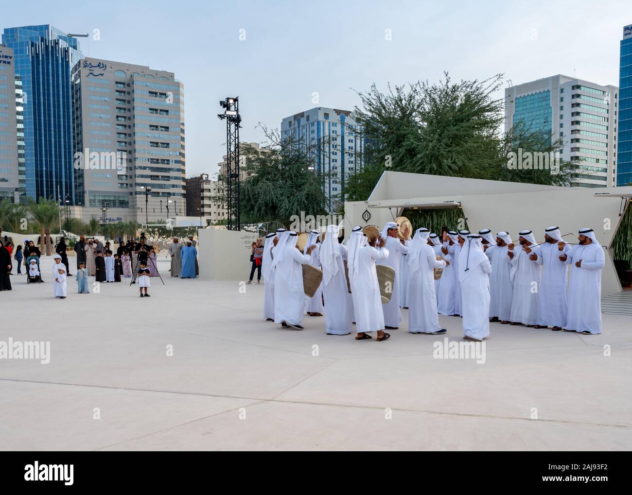 Middle Eastern Culture - Emirati Men performing Al Ayala traditional ...