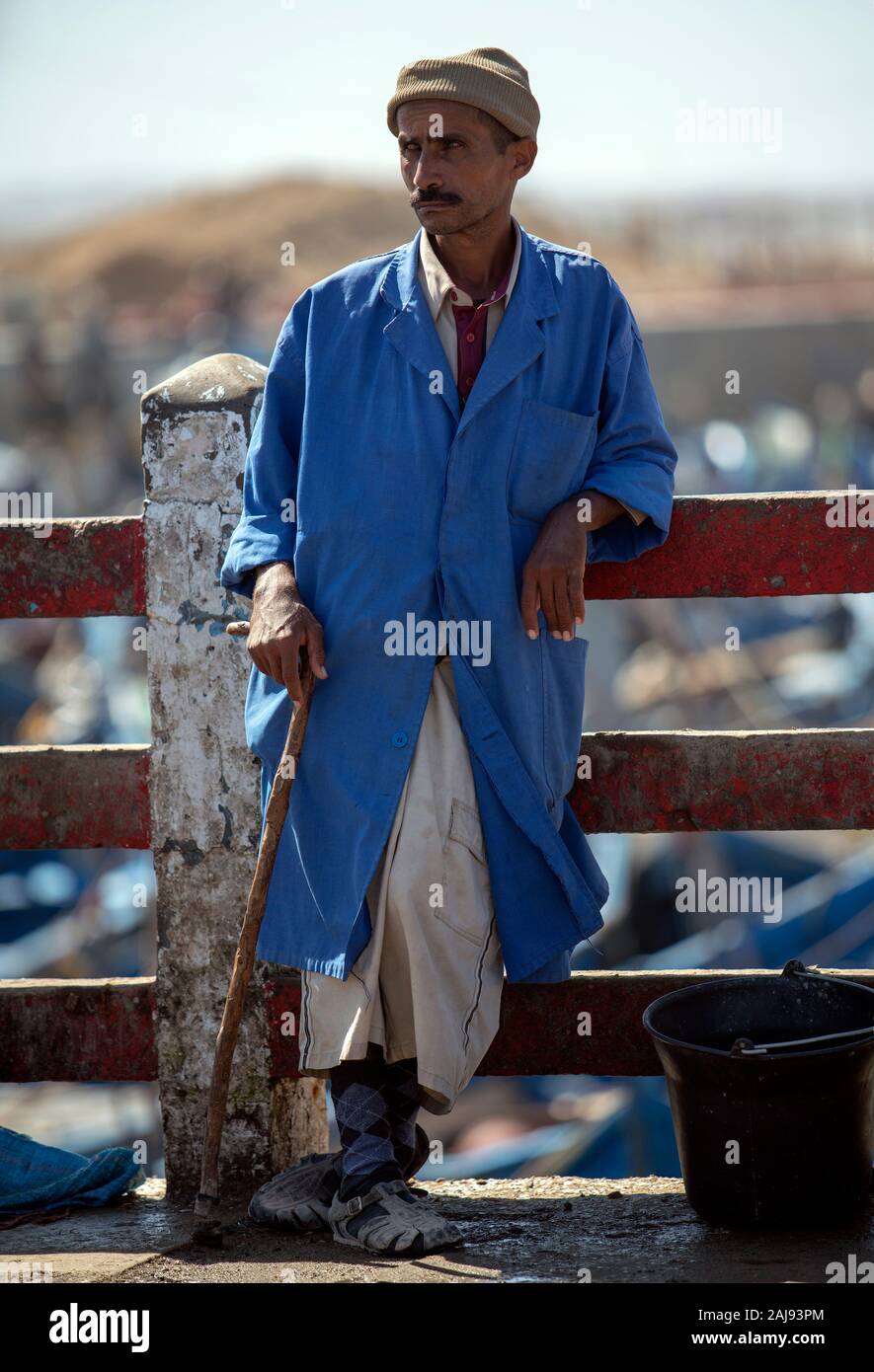 A man from North Africa is waiting with his cane Stock Photo - Alamy