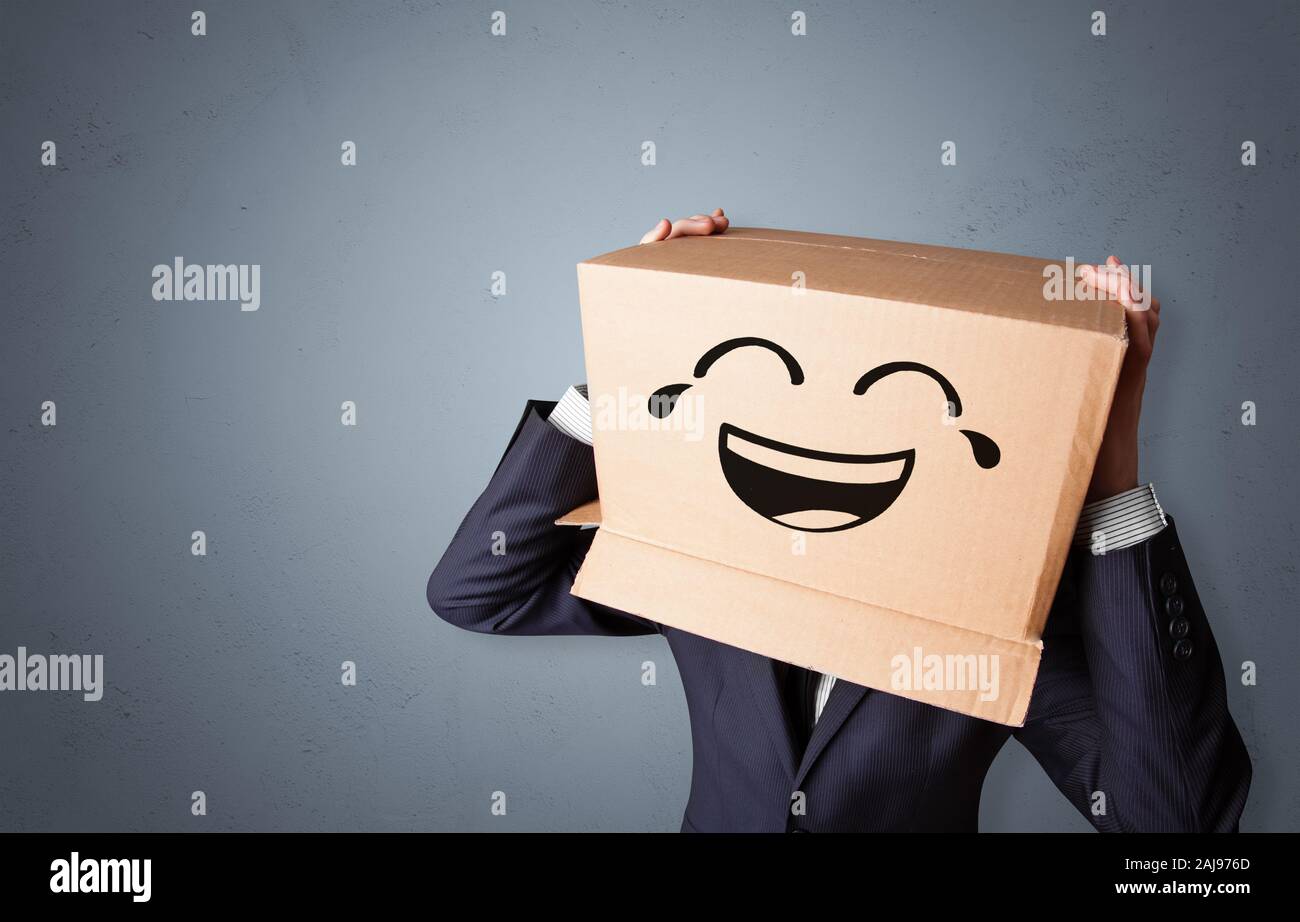 Funny man wearing cardboard box on his head with smiley face Stock ...