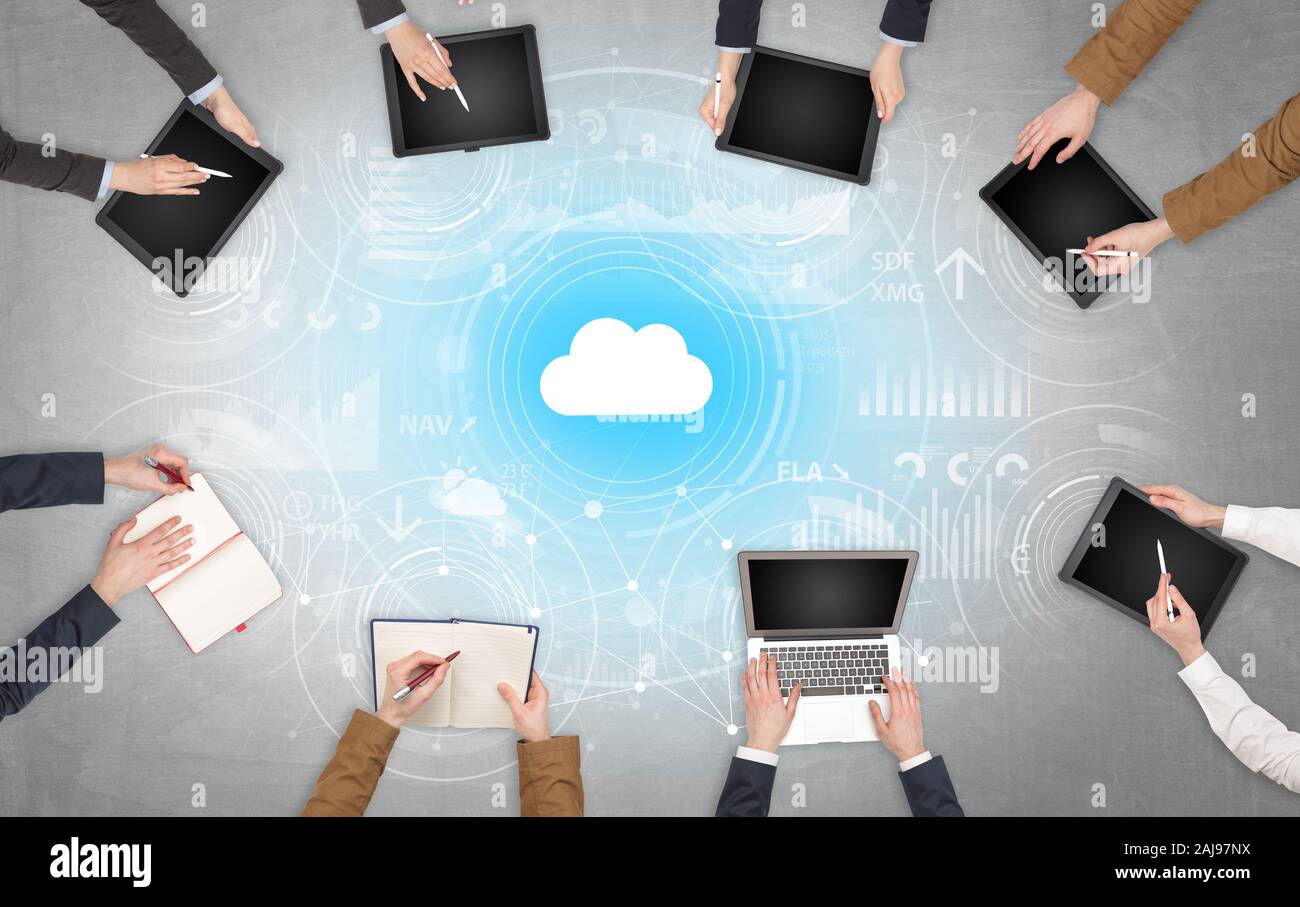 Group of people with devices in hands working on reports with online ...