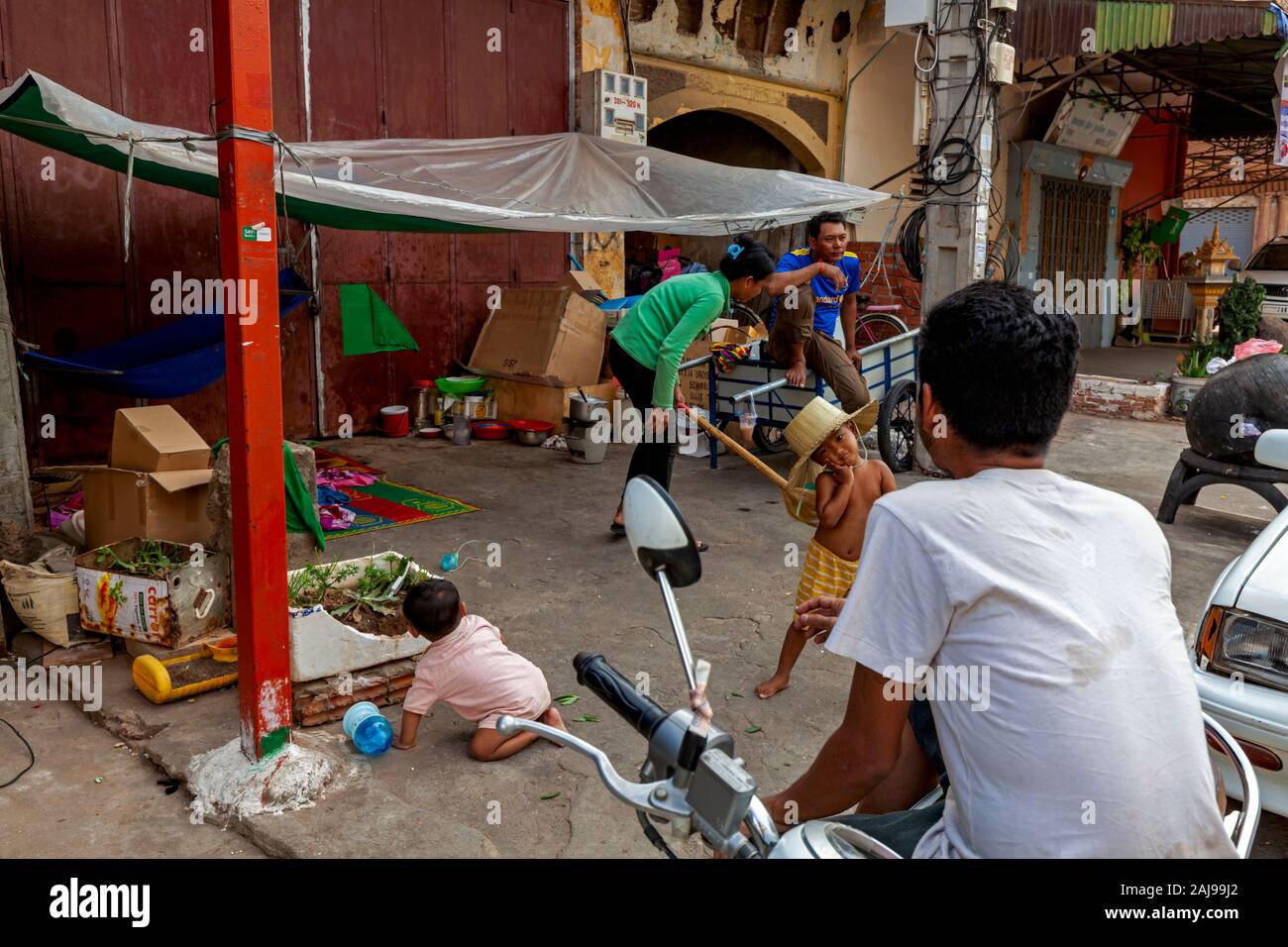 Poor homeless scavenger people are moving about at their makeshift ...