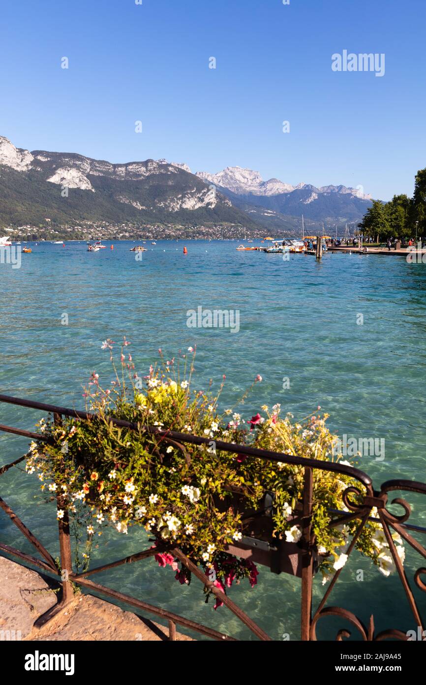 Panoramic view at the clear Alps water of Lake Annecy in France. Lake ...