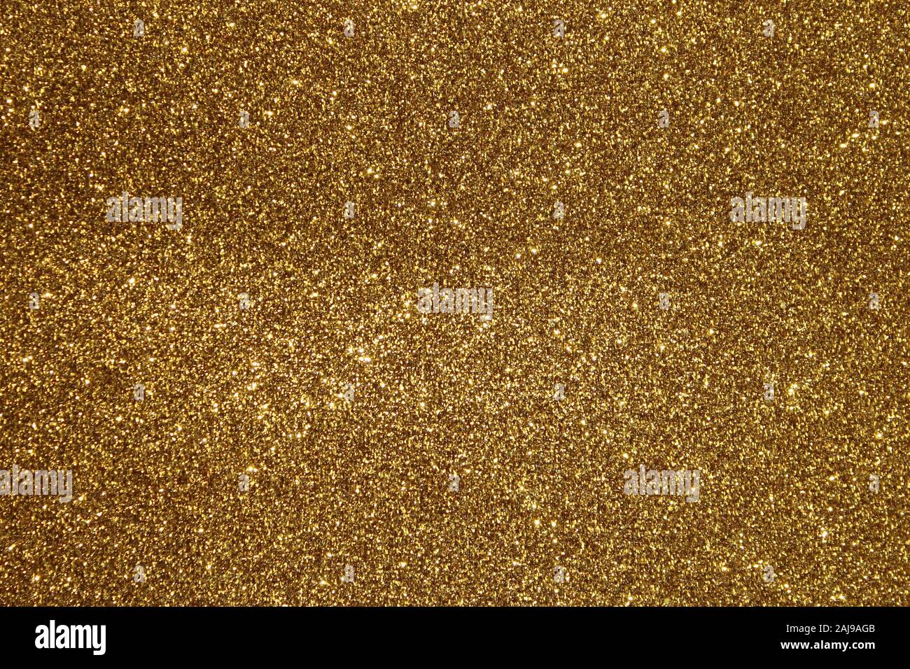 The picture shows a golden glittery background Stock Photo - Alamy