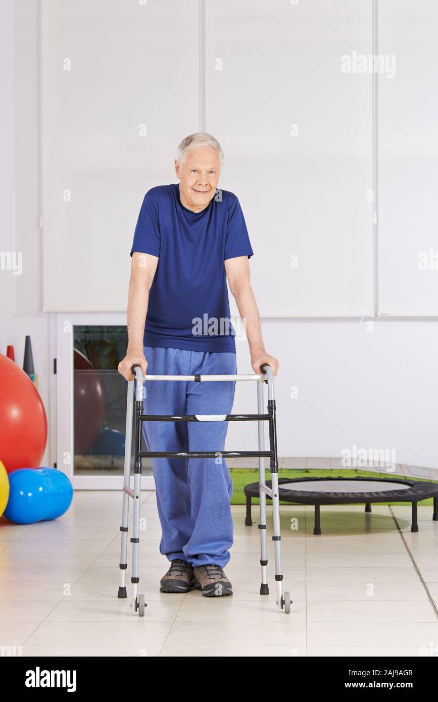Old man with walker at physiotherapy in nursing home Stock Photo - Alamy