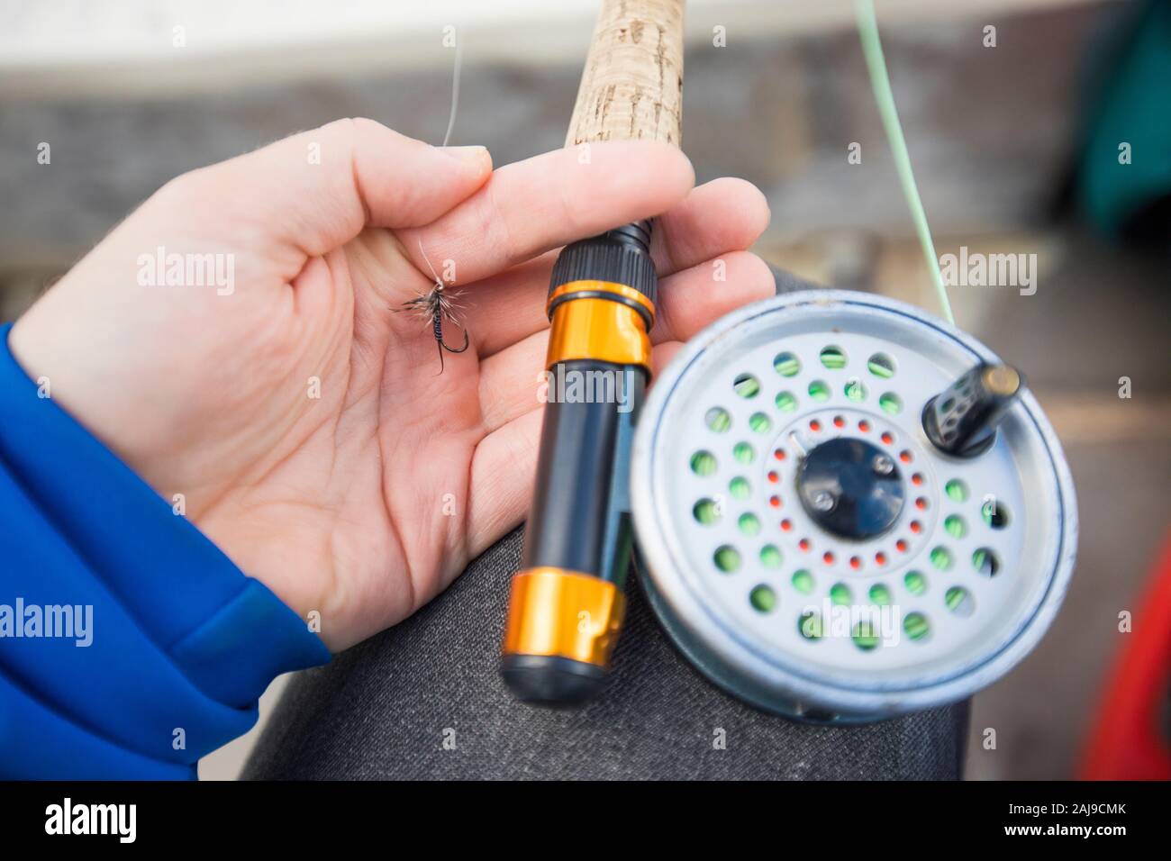 Woman Holding Fishing Rod With One Hand High Resolution Stock ...
