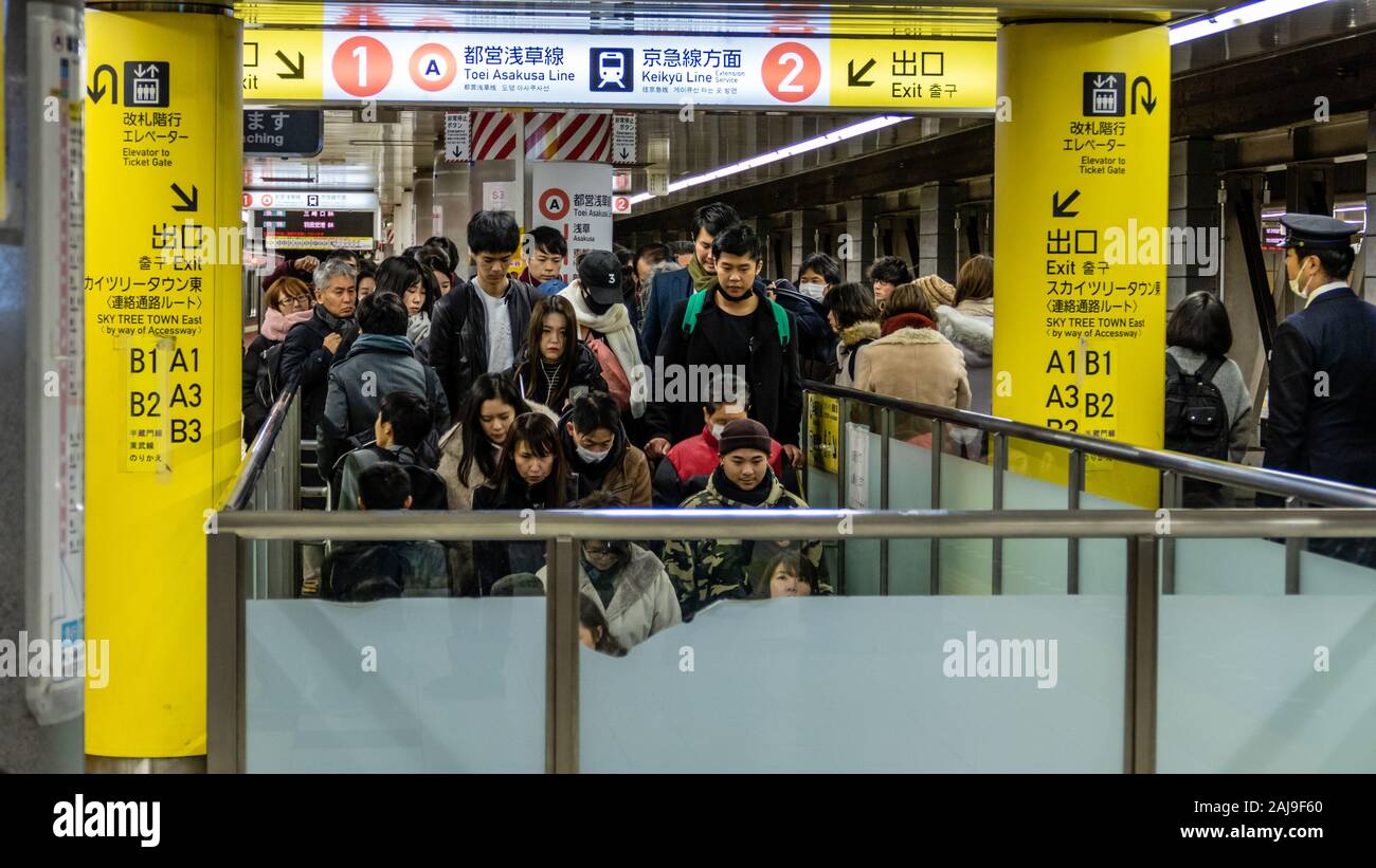 TOKYO, JAPAN - FEBRUARY 2, 2019: Commuters at Japanese subway train ...