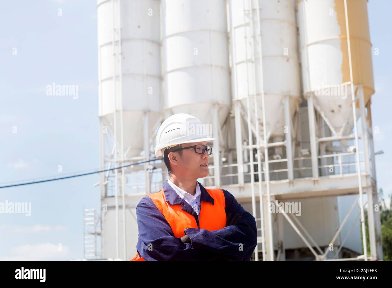 concrete worker with helmet in concrete plant Stock Photo - Alamy