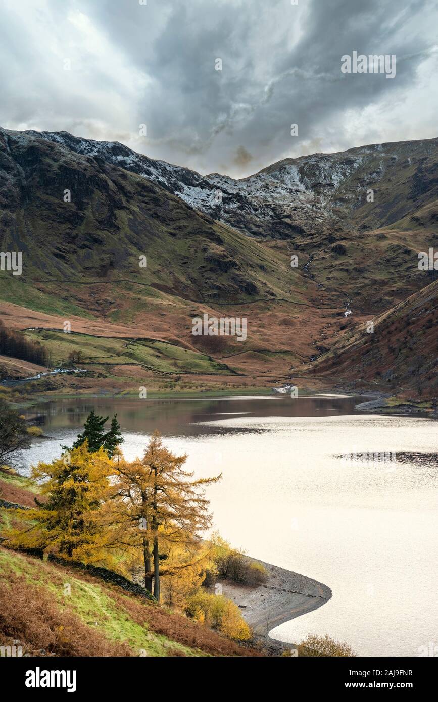 Epic Autumn Fall landscape of Hawes Water with epic lighting and ...