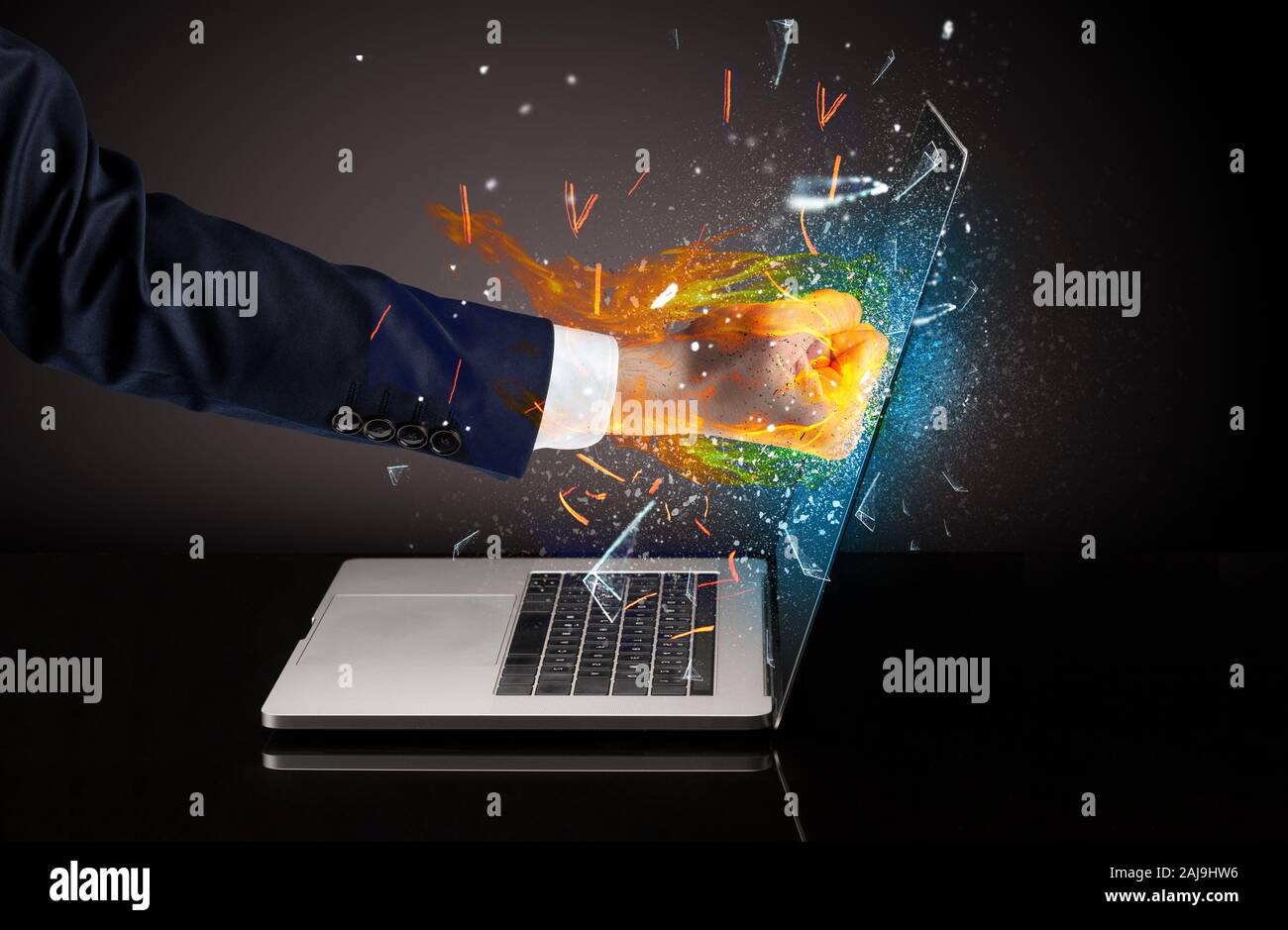 Firing hand hitting strongly laptop screen glass Stock Photo - Alamy