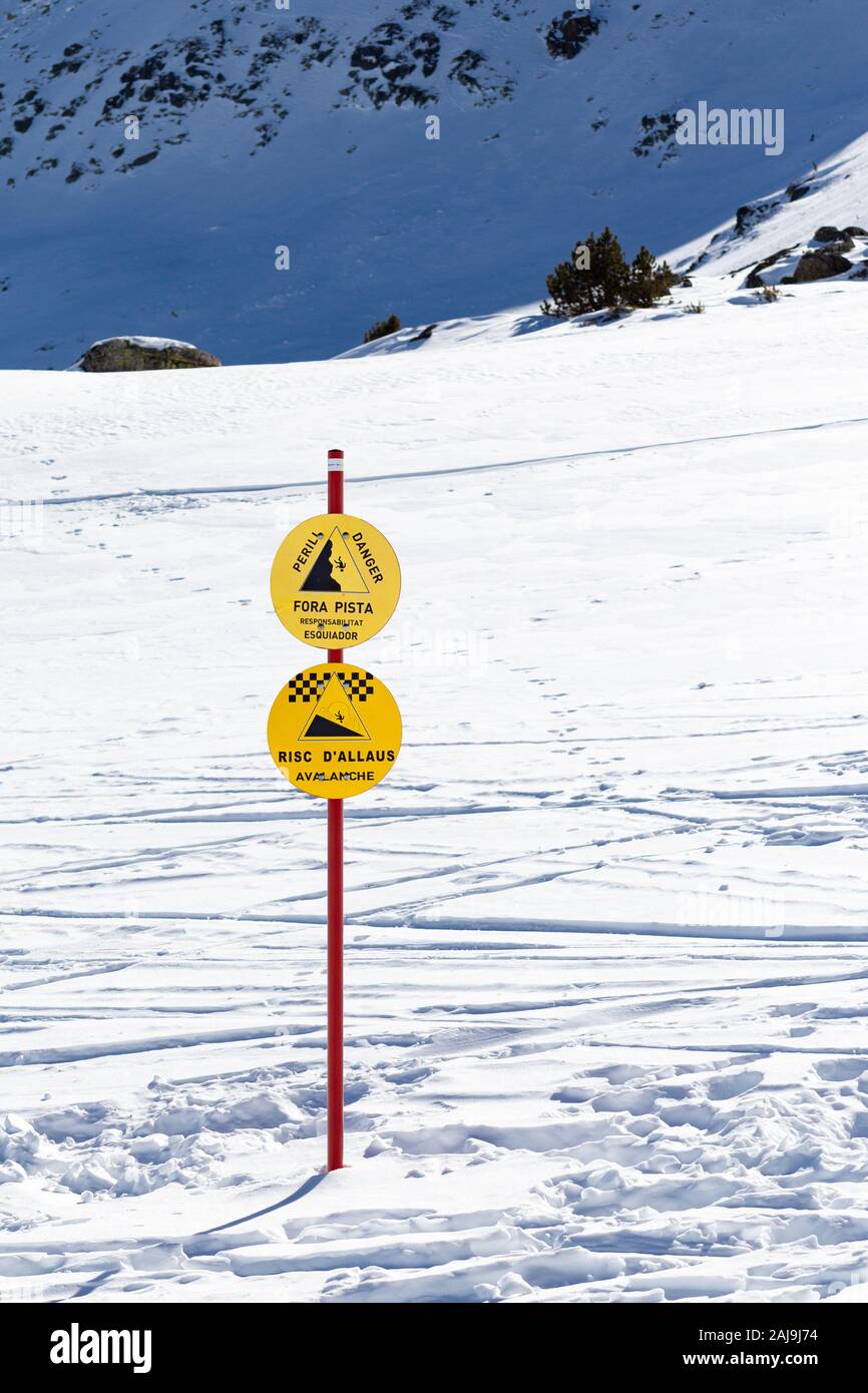 Signs in the mountains at a ski resort with hazard warnings Stock Photo ...