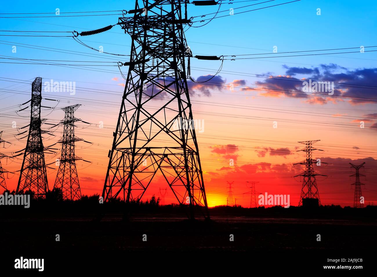 The silhouette of the evening electricity transmission pylon Stock ...