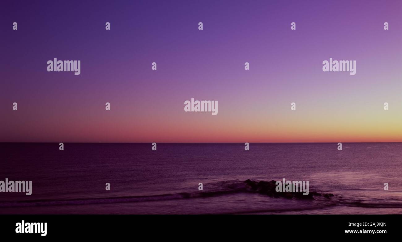 Serene Pink Yellow and Blue Horizon at Dawn Stock Photo - Alamy
